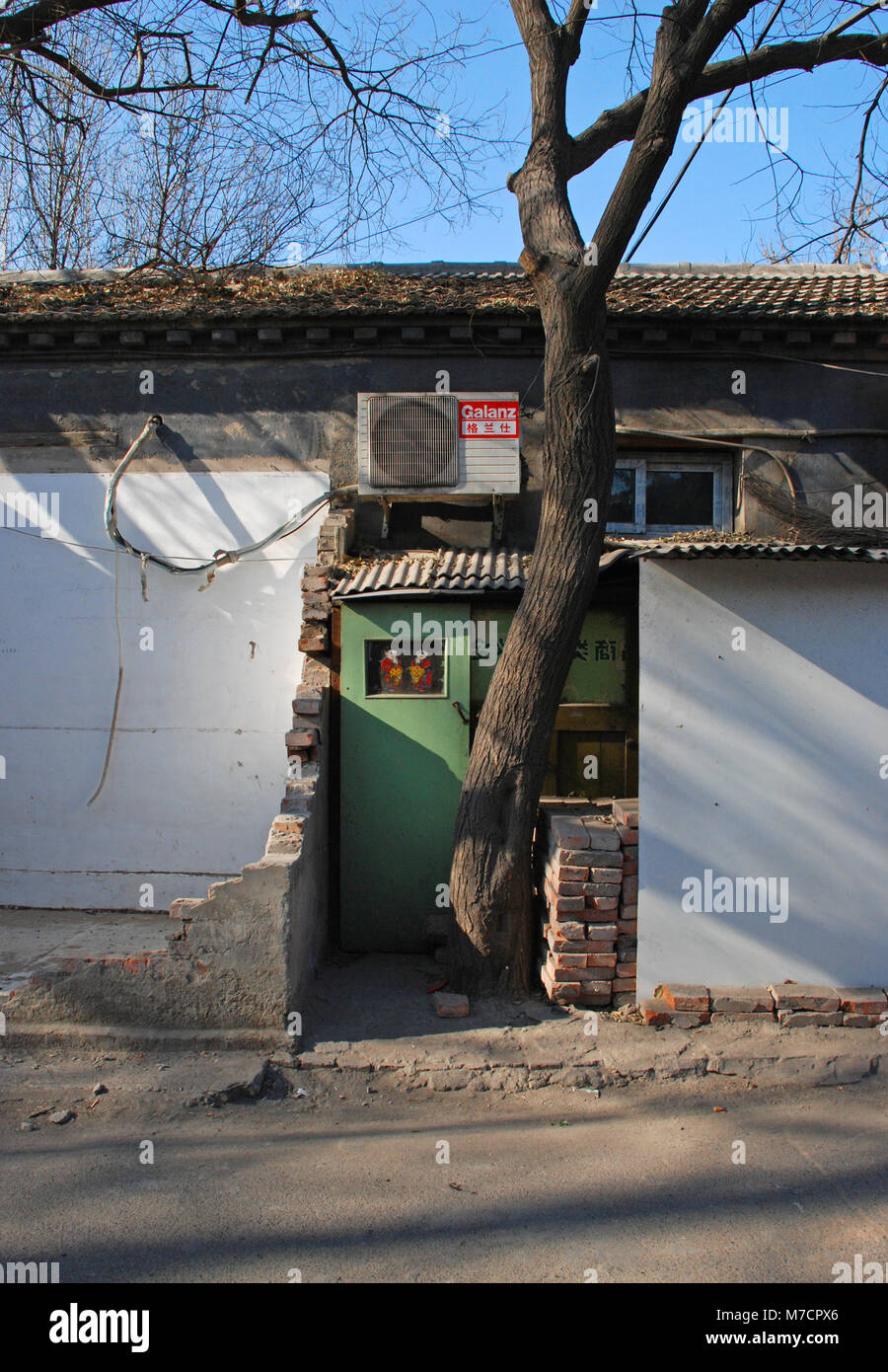 A door on a house in one of Beijing's old Hutongs, or alleys, that ...