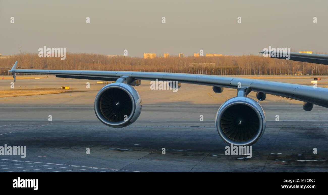 Engines on the wing of an aircraft in international airport Stock Photo ...