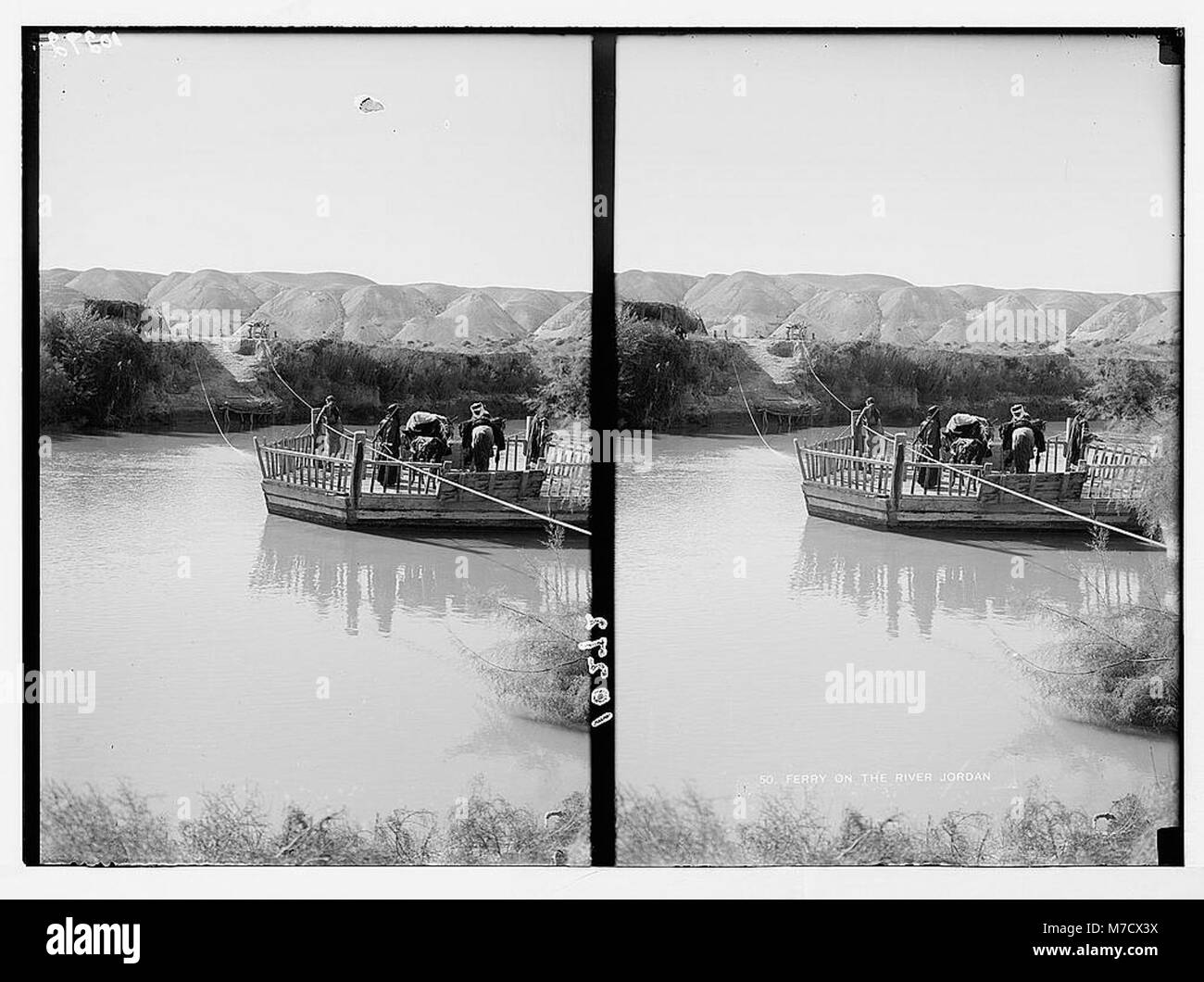 A ferry boat on the River Jordan is captured in this historical ...