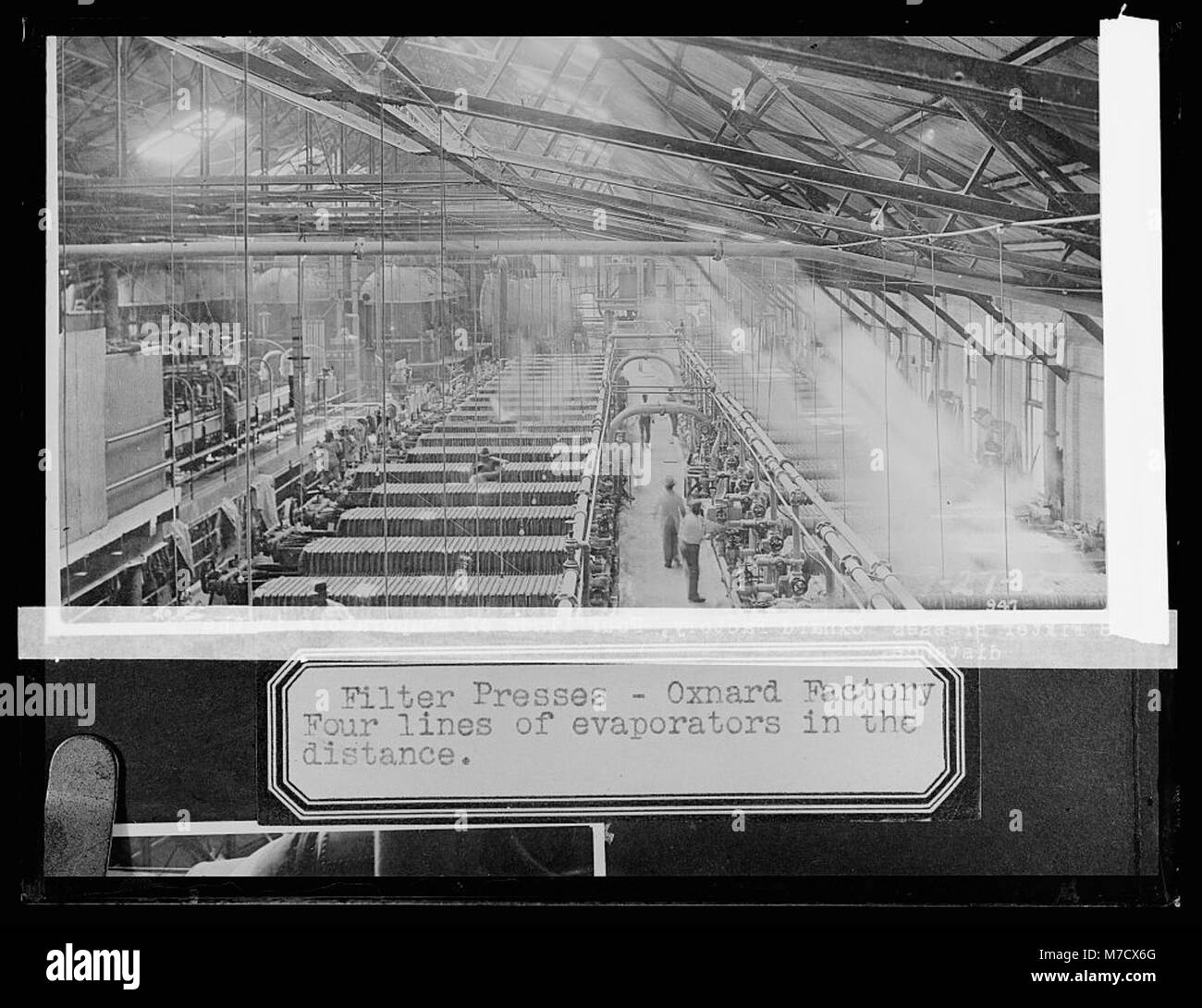 In a factory in Oxnard, California, filter presses are operating while ...