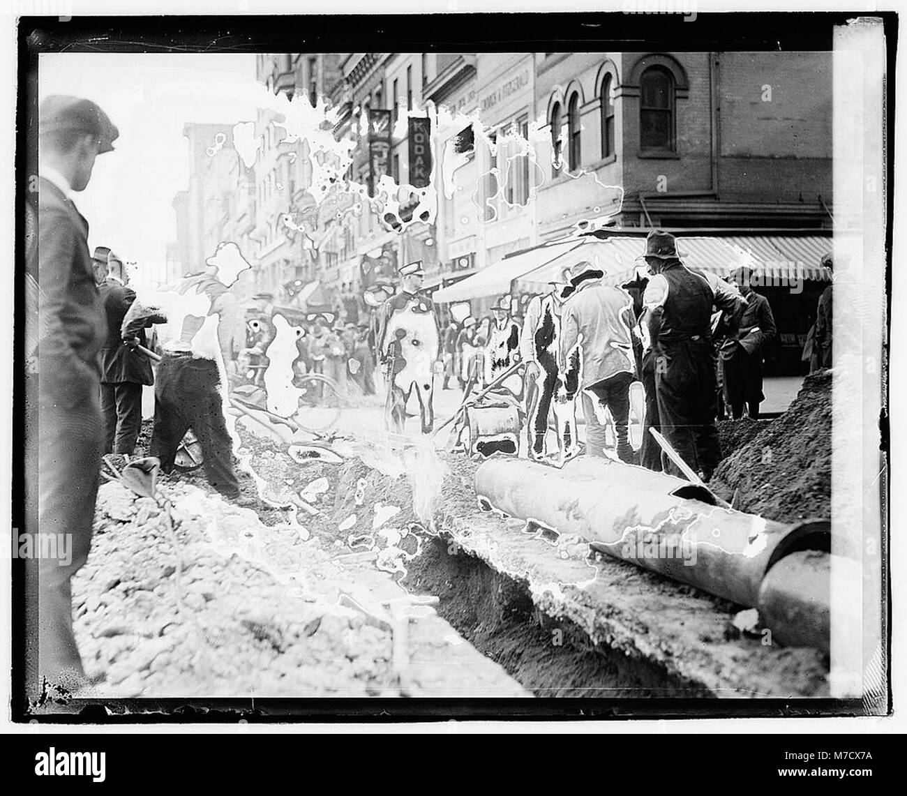 A photograph capturing the aftermath of a fire caused by a gas main ...