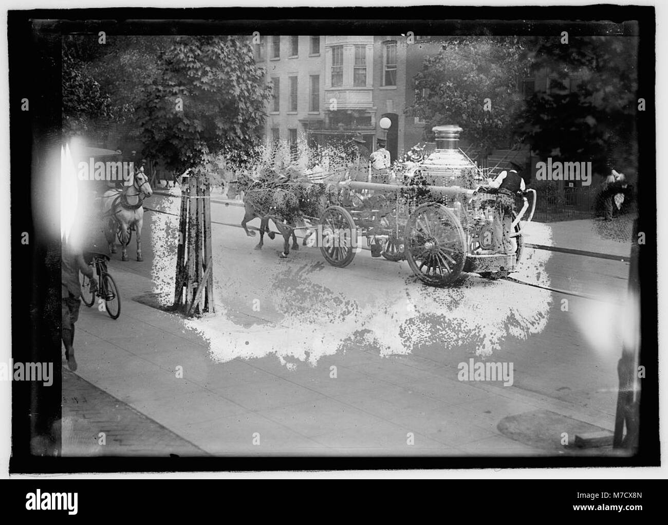 A historical image of a fire engine, showcasing the early designs and ...