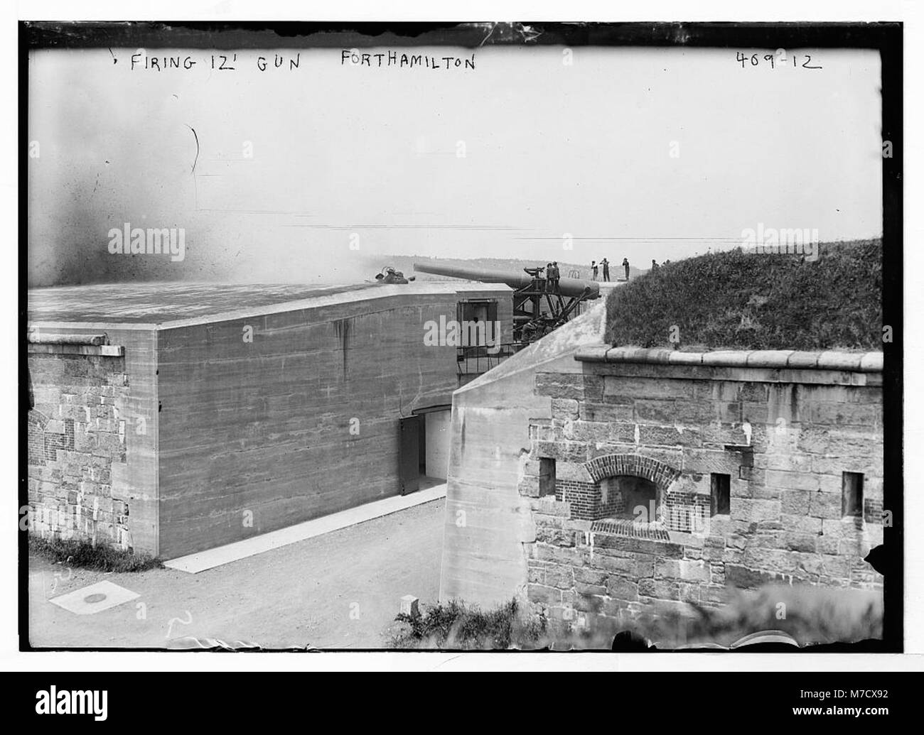 A dramatic moment capturing the firing of a 12-inch gun at Fort ...
