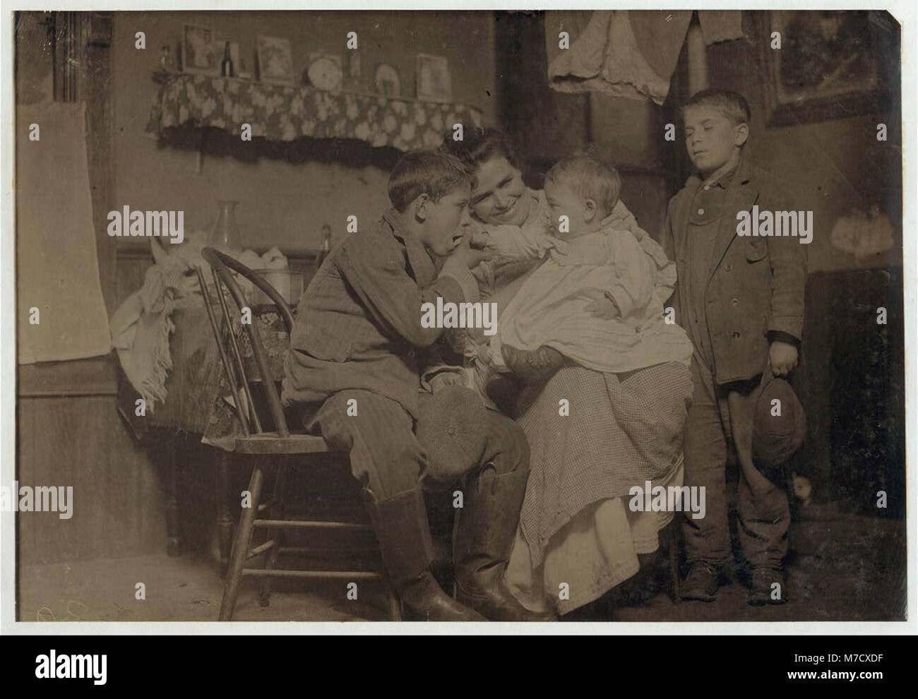 A flash-lit photo showing John Sousa sitting with his mother and ...