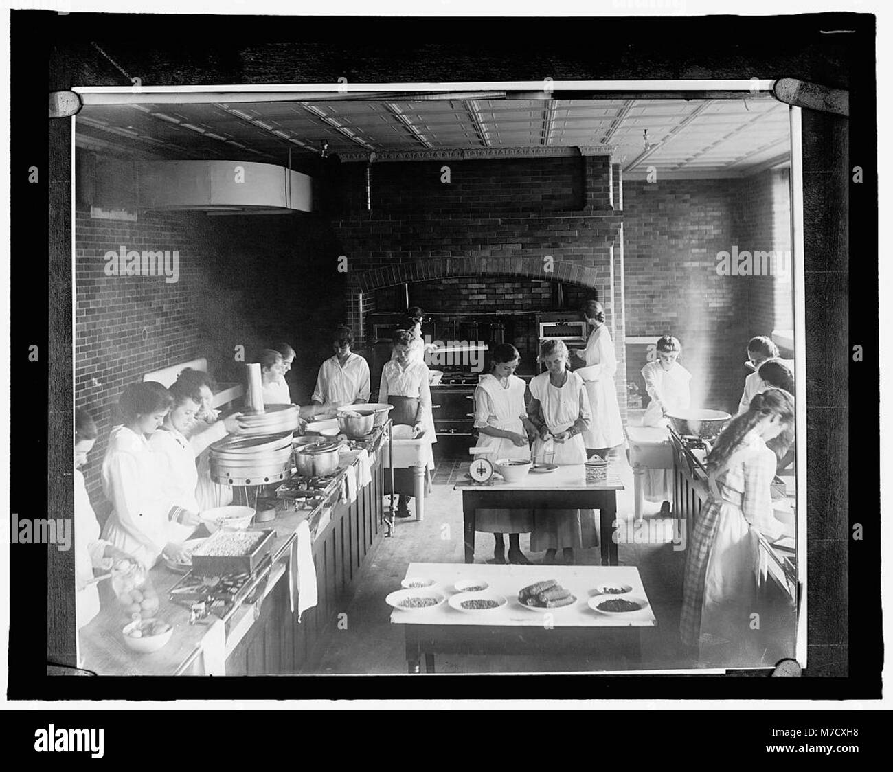 The image depicts the U.S. Food Administration's canning process during ...