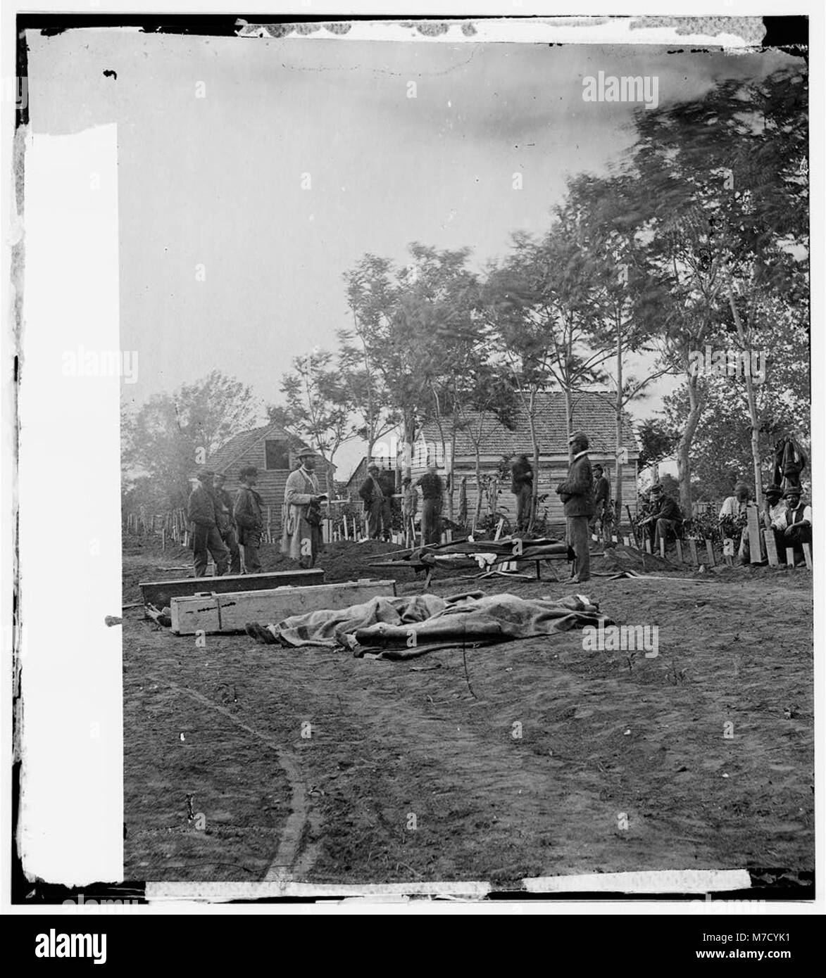 A somber image depicting the burial of Federal soldiers at ...
