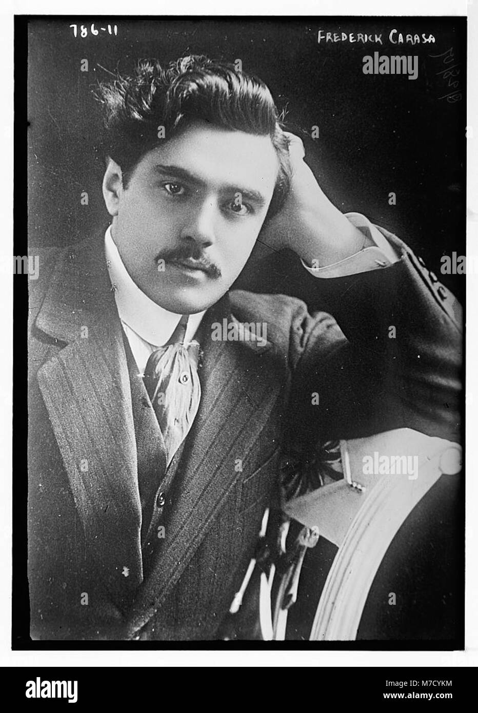 A portrait of Frederick Carasa seated. The image captures him in a ...