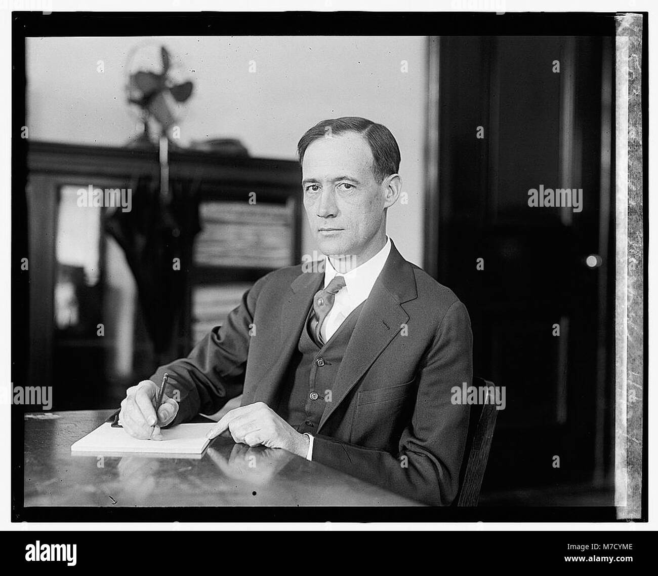 A formal portrait of Fredk. Moore, capturing his distinguished ...