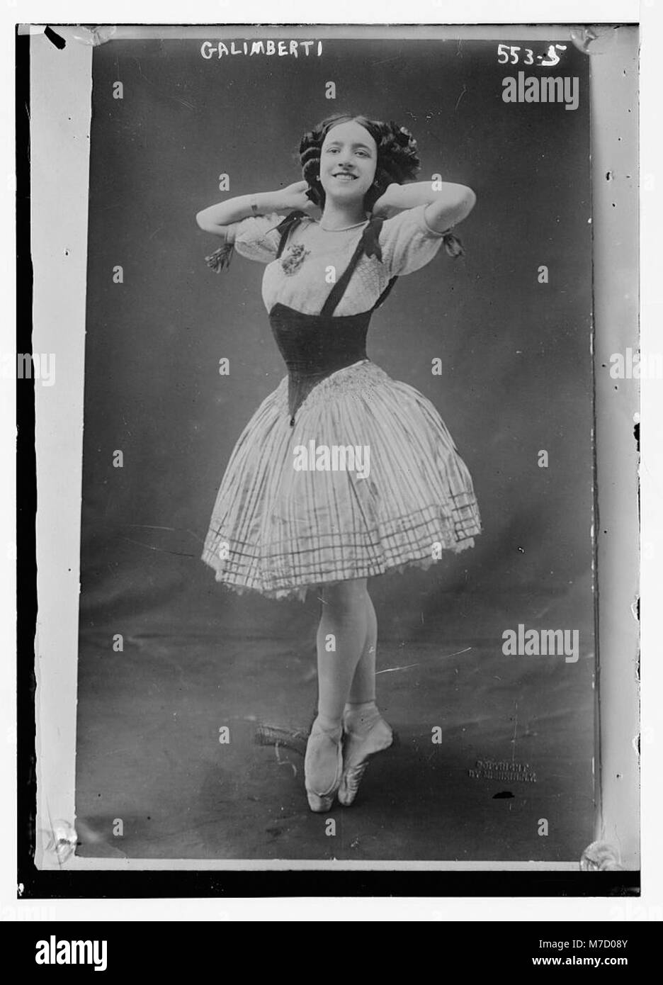 The image features a dancer performing toe dancing, captured by Mishkin ...