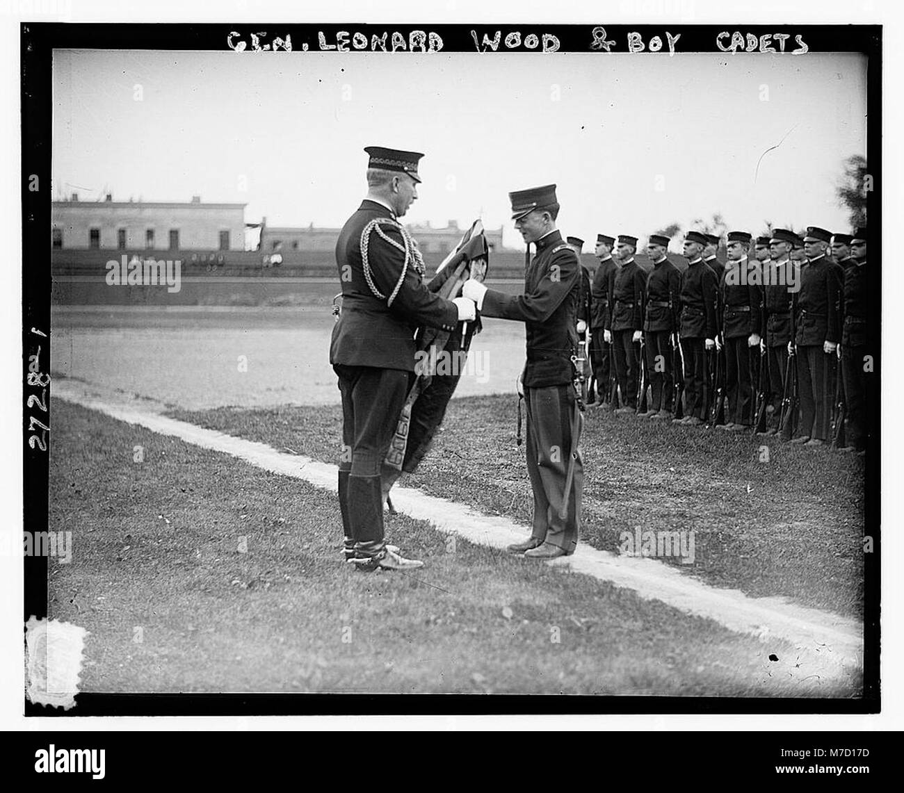 This image shows General Leonard Wood with a group of boy cadets. It ...