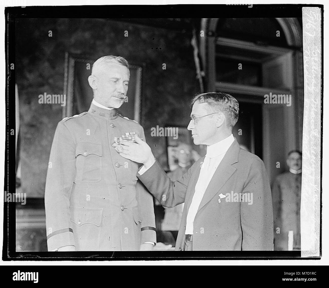 General Peyton C. March is seen receiving the first victory medal from ...