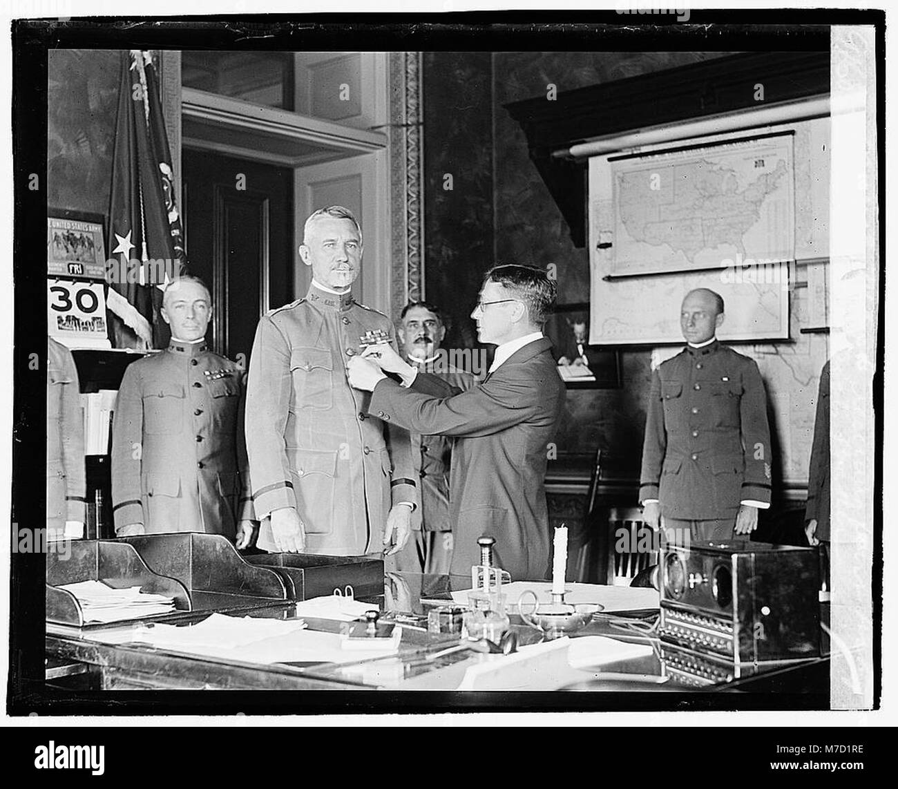General March is presented with the first victory medal by Secretary ...