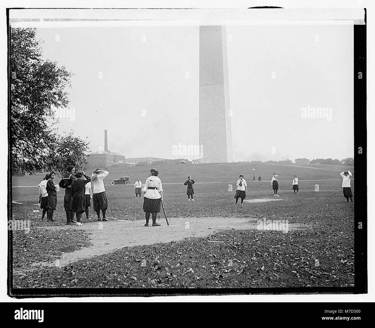 A historical photograph showing a girls' baseball game on October 10 ...