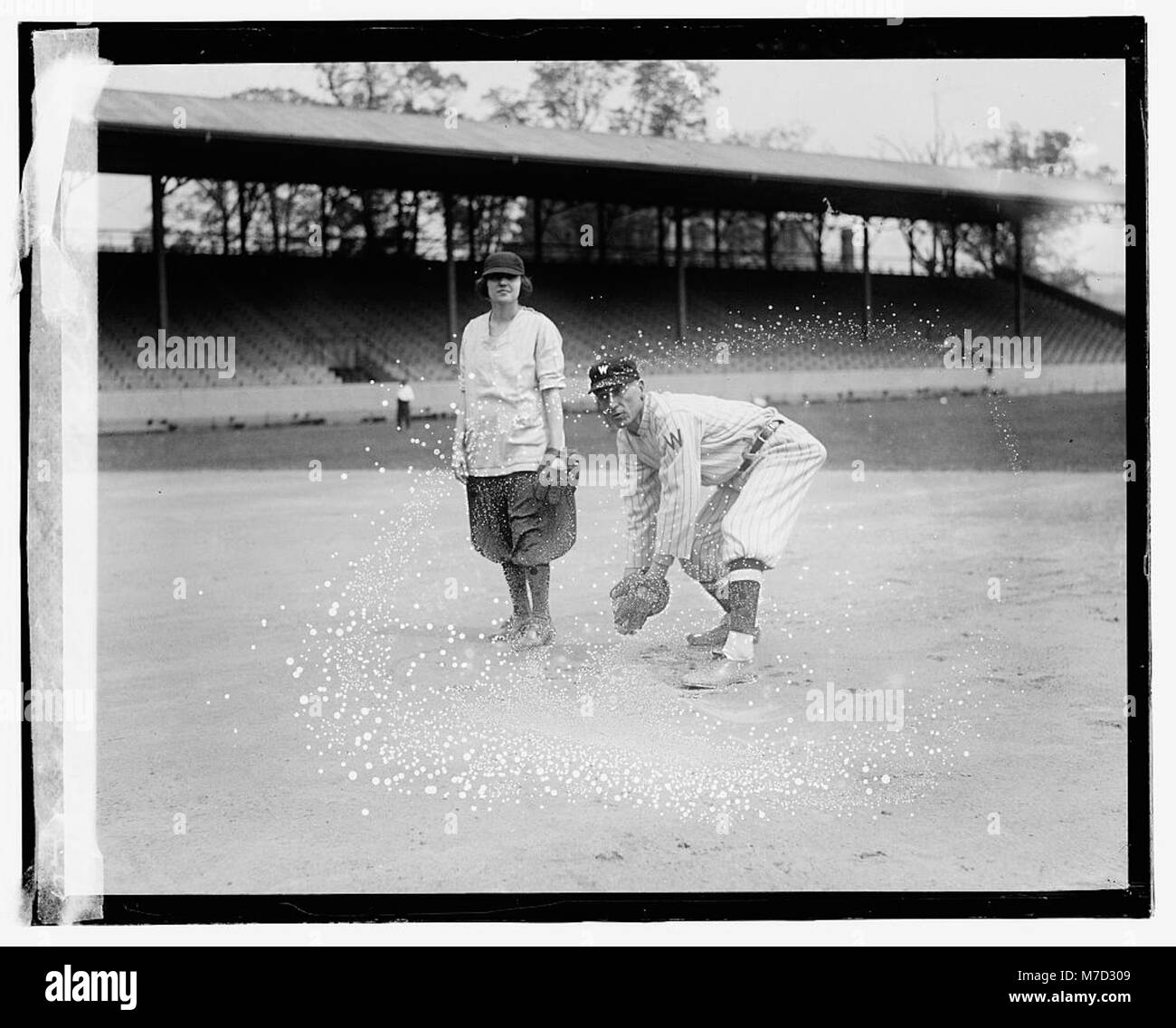 The image shows a girls' baseball team in action, demonstrating skill ...