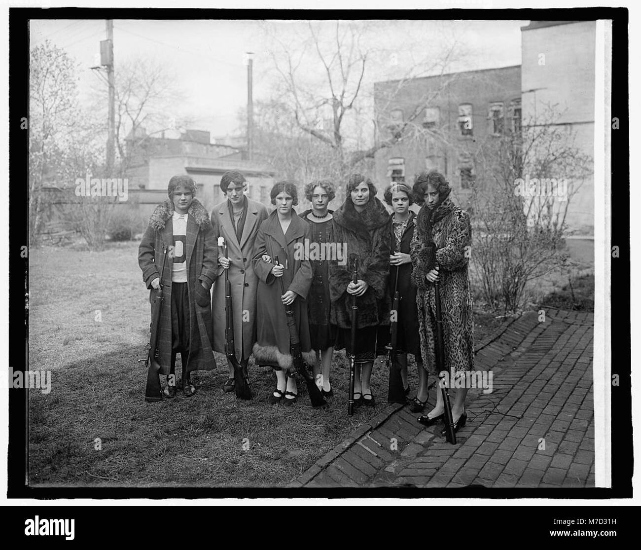 The photograph features the girls' rifle team from Drexel Institute ...