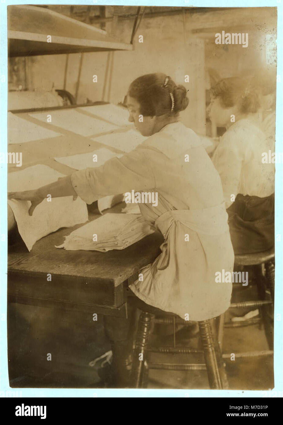 A historical photograph showing a group of 15-year-old girls working at ...