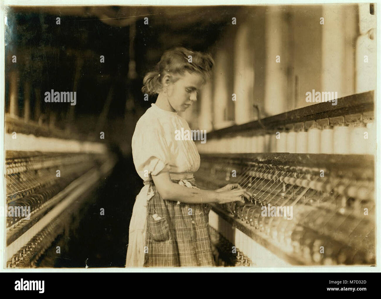 A portrait of a young girl working at the Cherryville Mill, reflecting ...