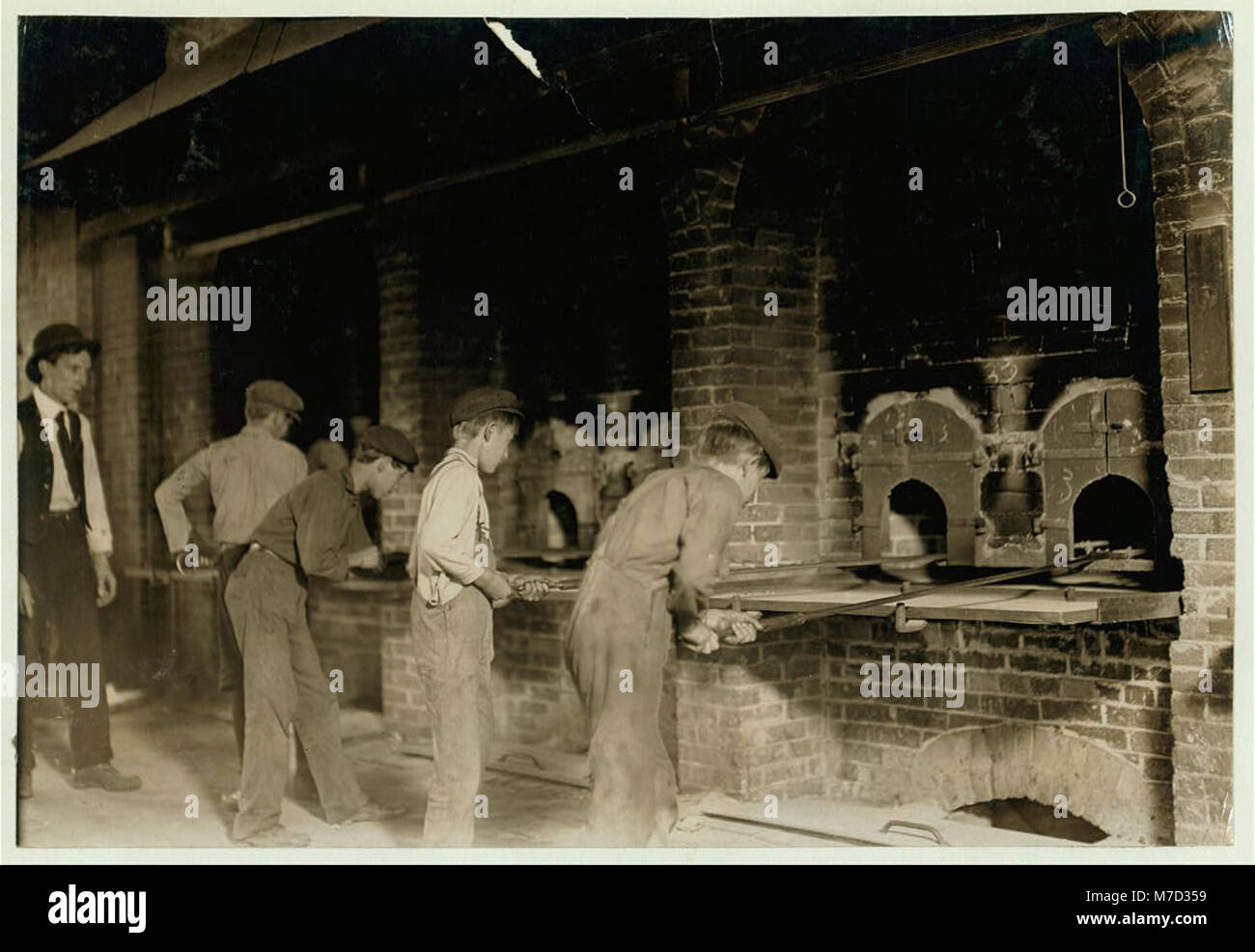 A photograph of glass works, depicting the manufacturing process and ...