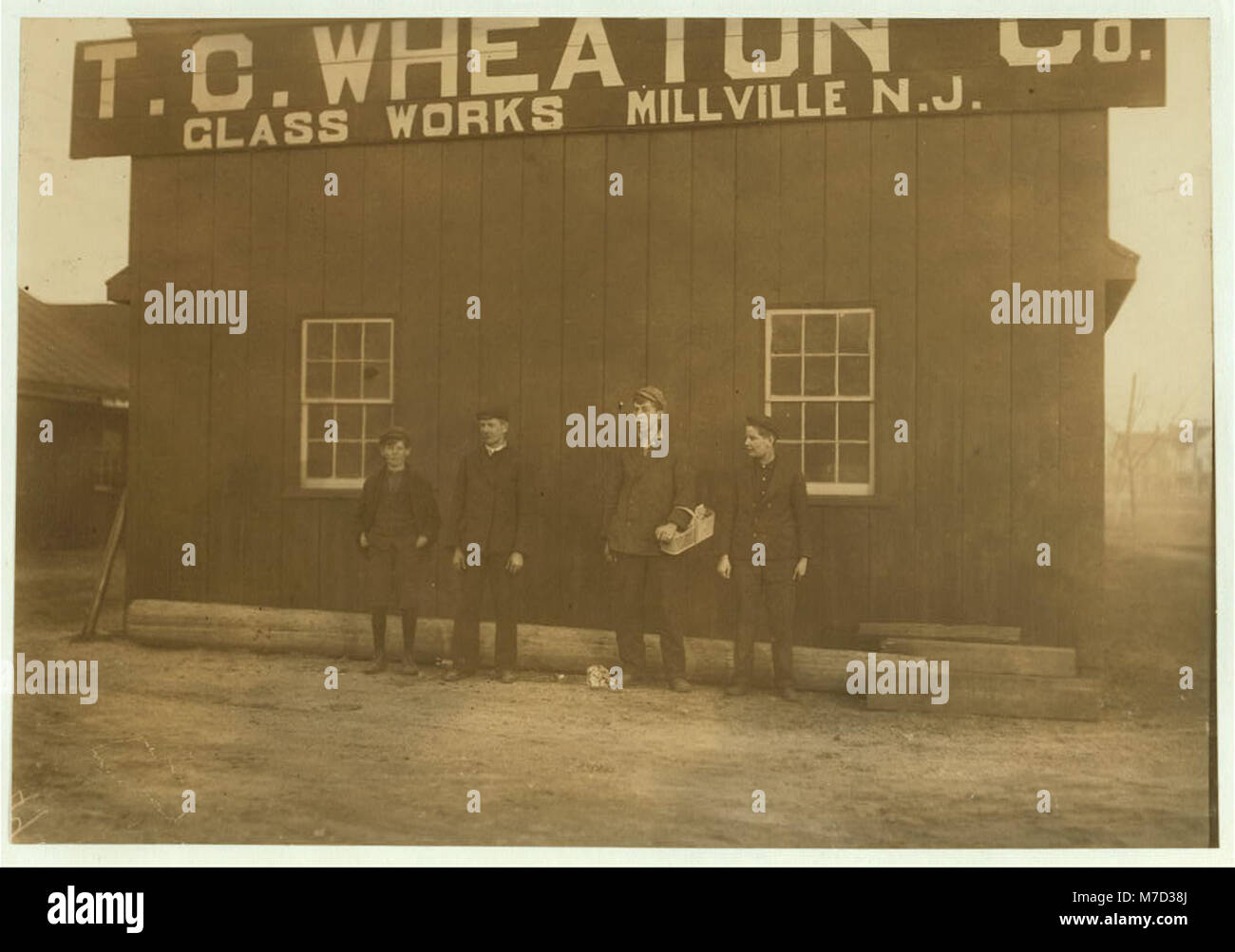 A historical photo depicting workers leaving Wheaton Glass Company in ...