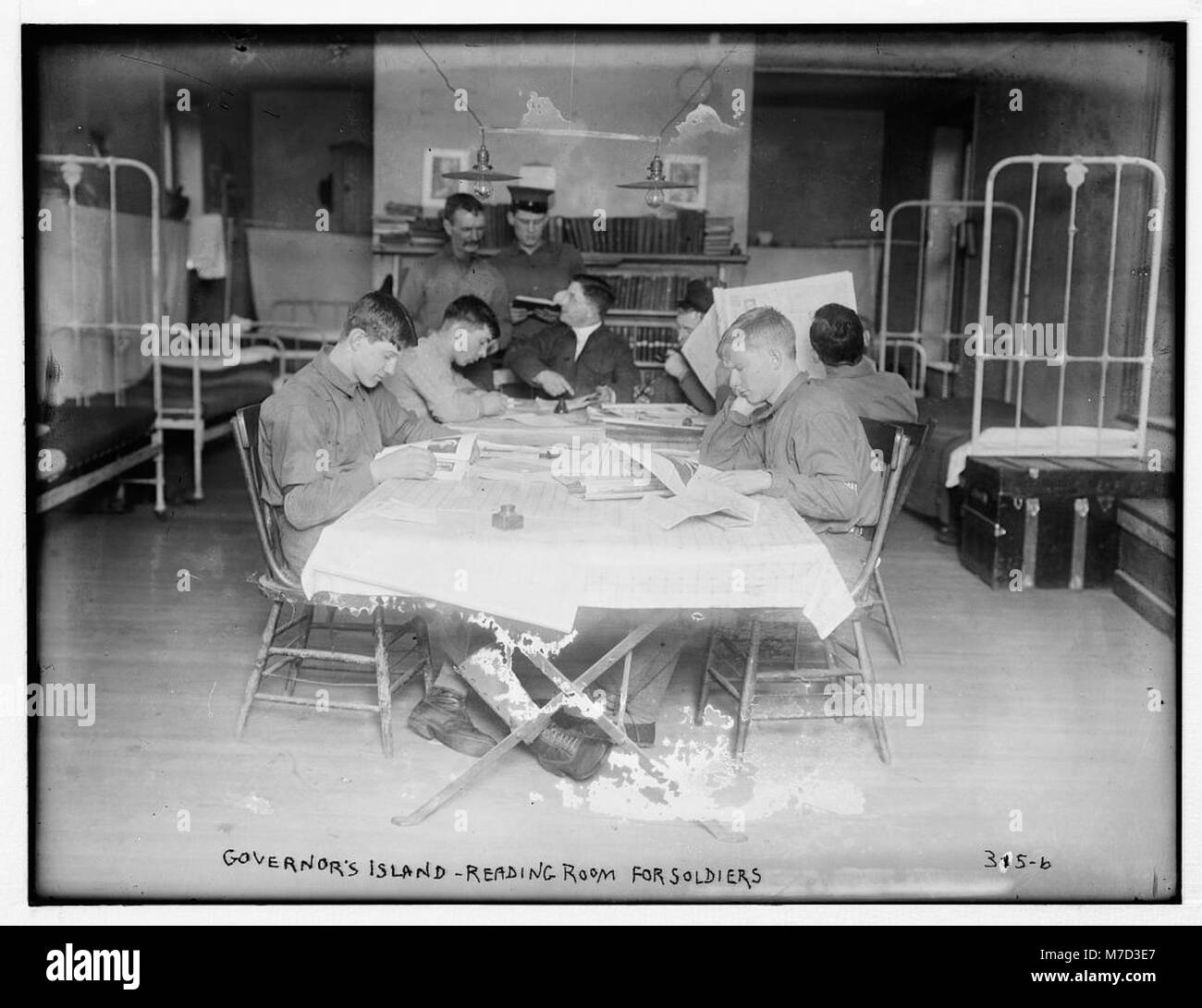 A historic photograph of the reading room on Governor's Island ...