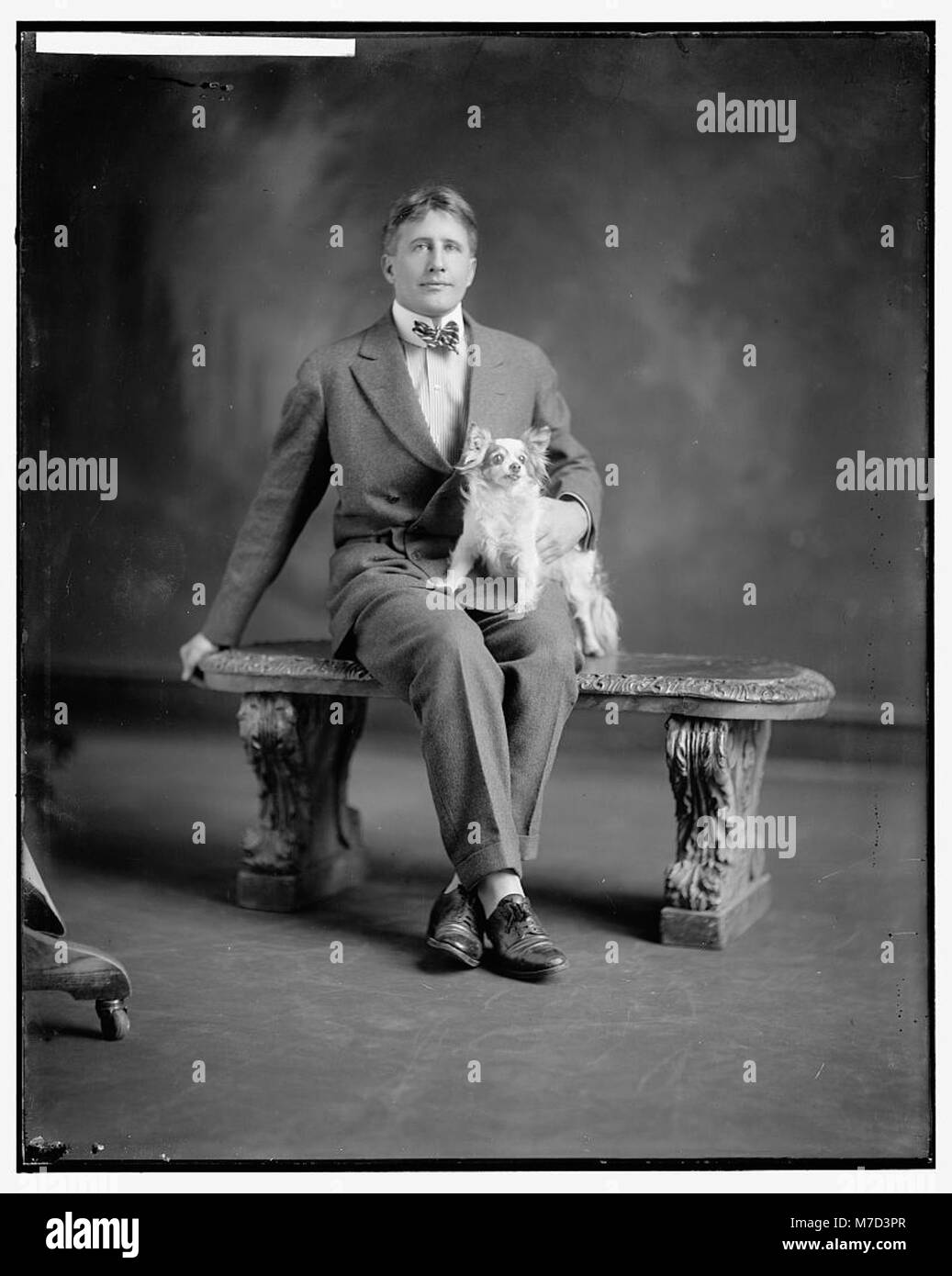 A portrait of Thomas Grant, shown with his dog. This image captures a ...