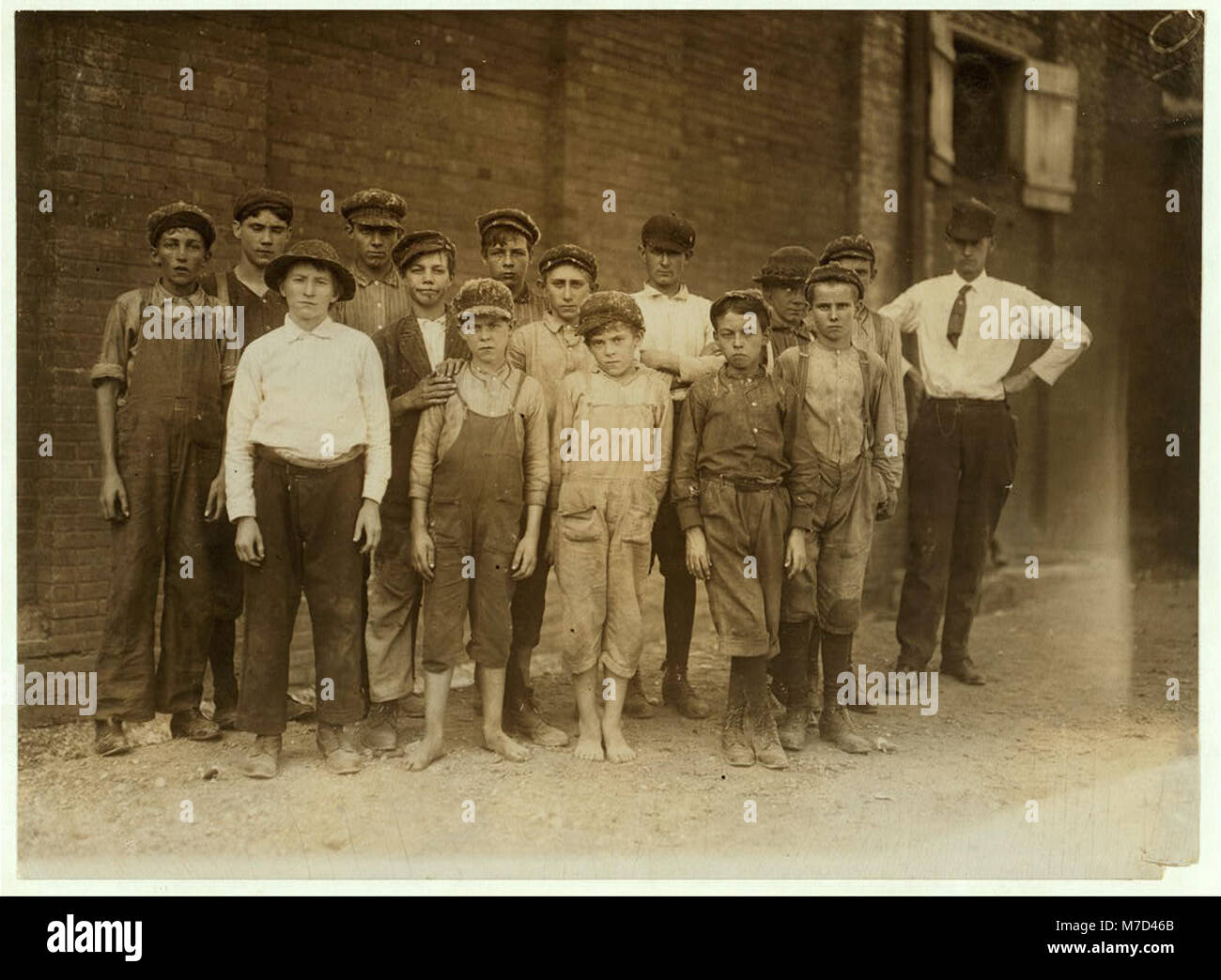 A photograph depicting a group of doffers in Pell City Cotton Mill ...