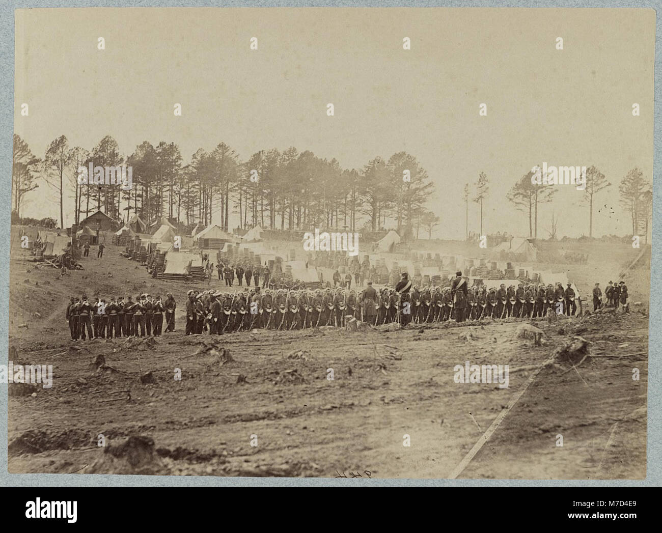 This photograph shows a guard mount at the Camp of the 114th ...