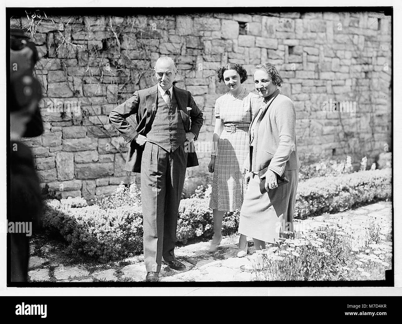 A formal photograph of Sir Harold, Lady McMichael, and Miss McMichael ...