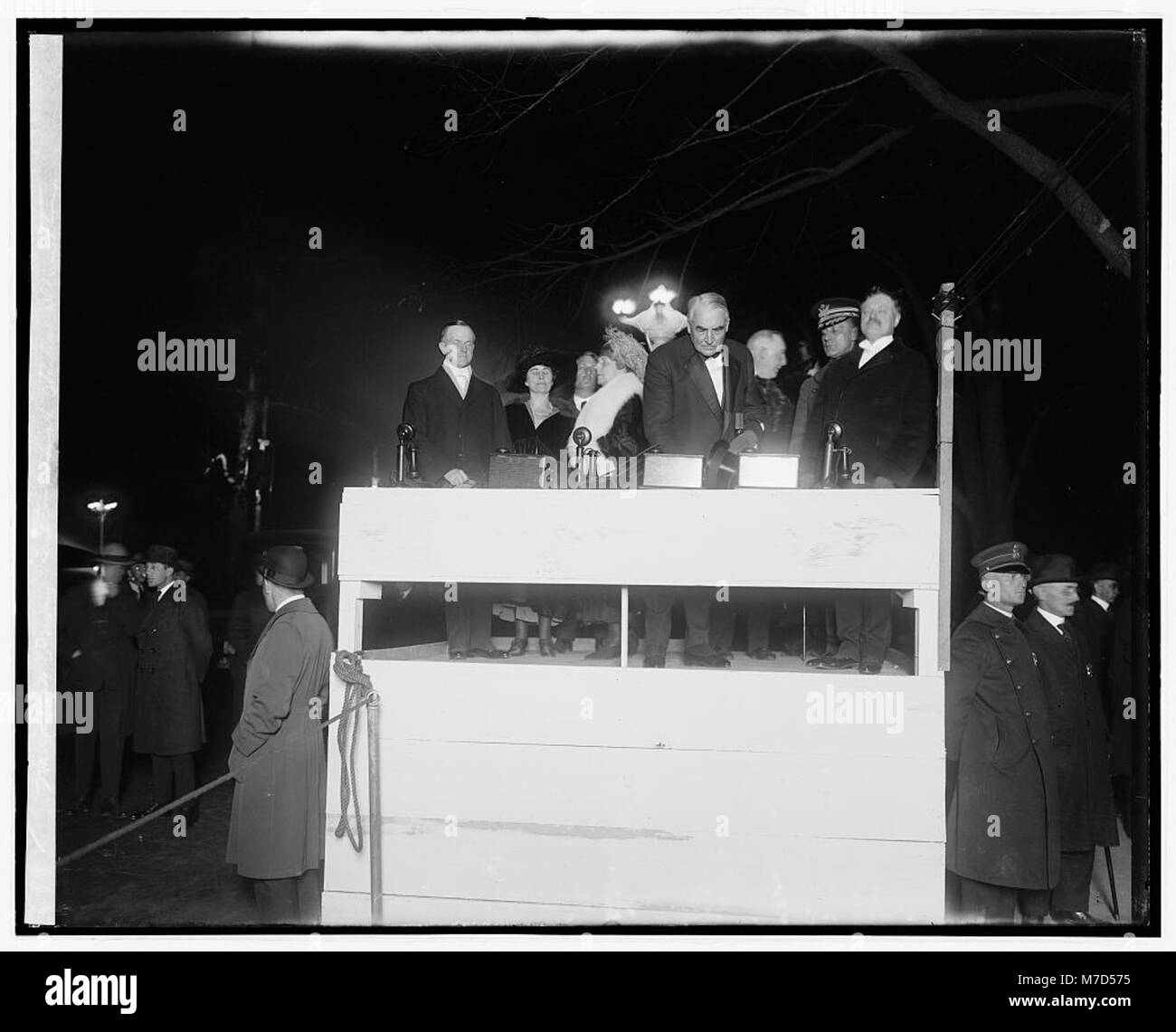 Photograph of President Warren G. Harding pressing the button to start ...