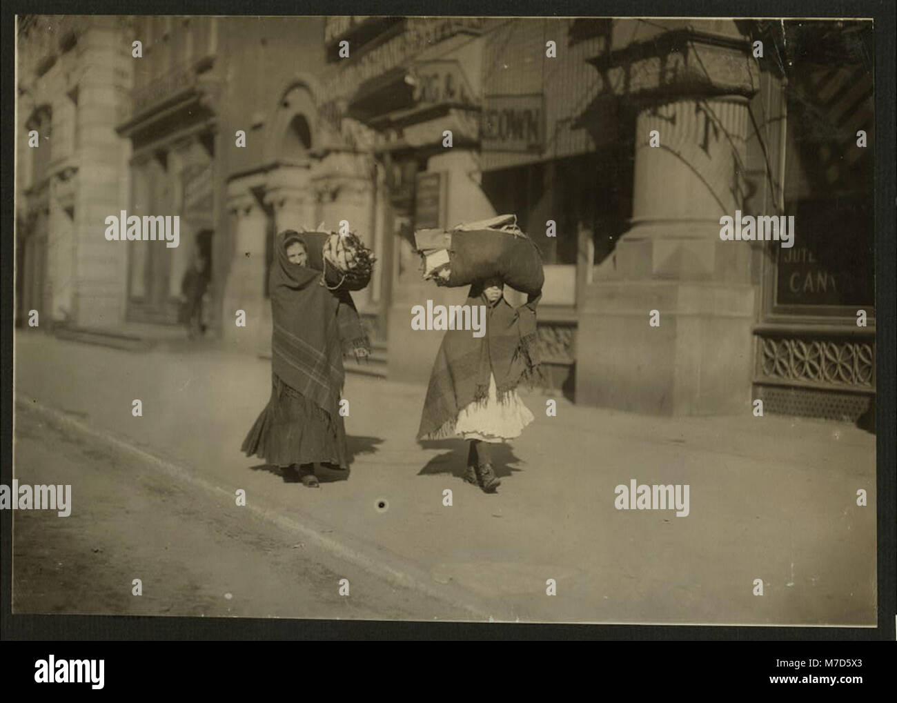 A photograph capturing heavy loads of garments being transported for ...