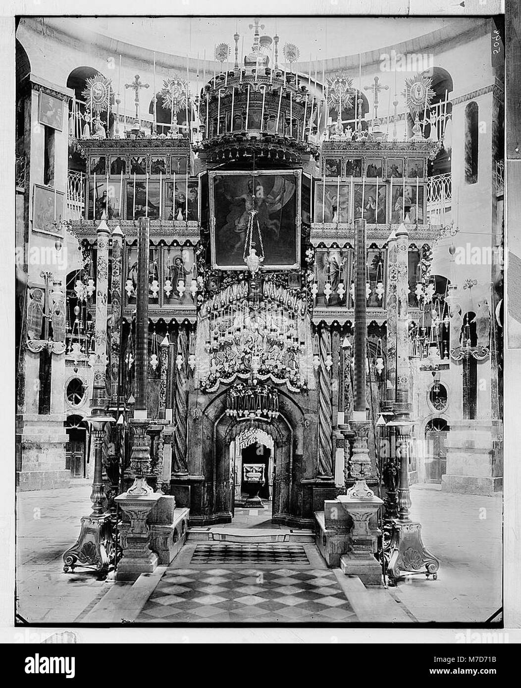 This image depicts the Tomb of Christ within the Church of the Holy Sepulchre in Jerusalem, an ...