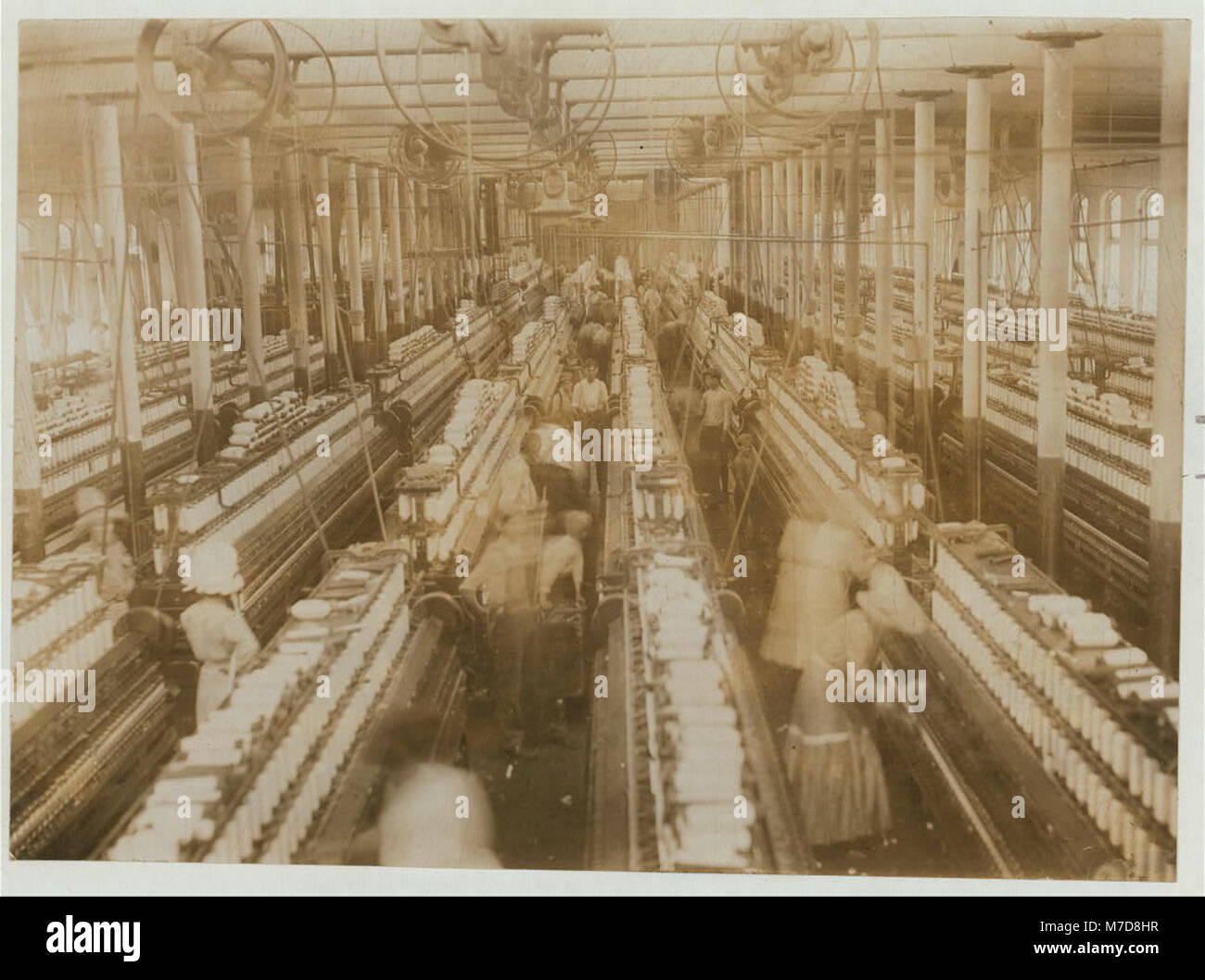 Interior of Magnolia (Miss.) Cotton Mills spinning room. See the little ...
