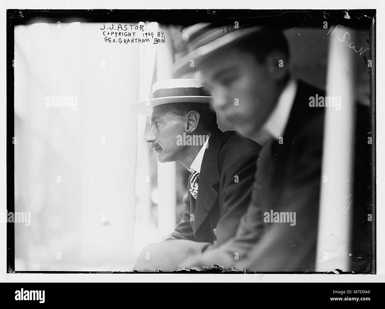 A portrait of J.J. Astor, captured leaning from a train window ...