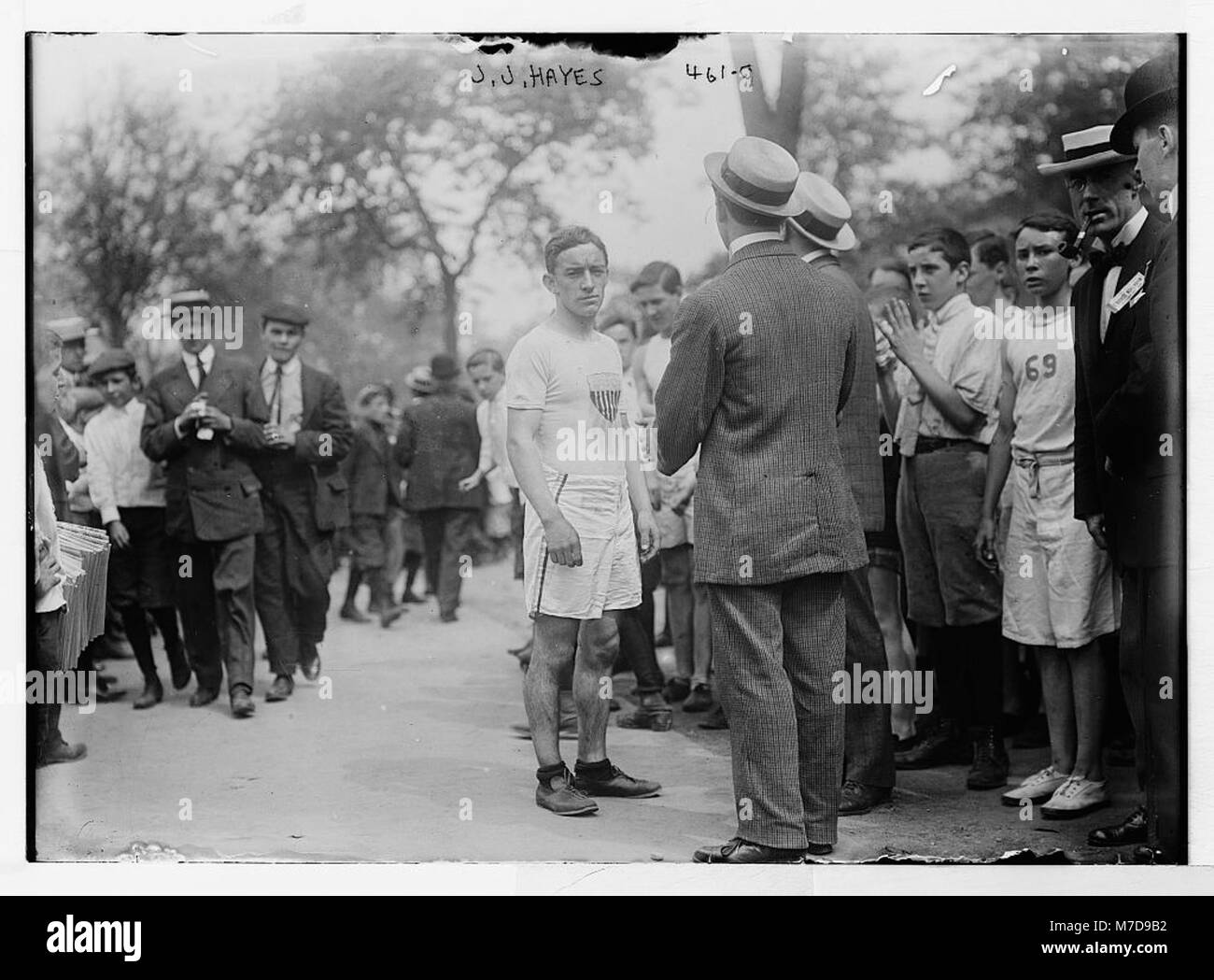 A historical image of a crowd gathered to watch J.J. Hayes race ...