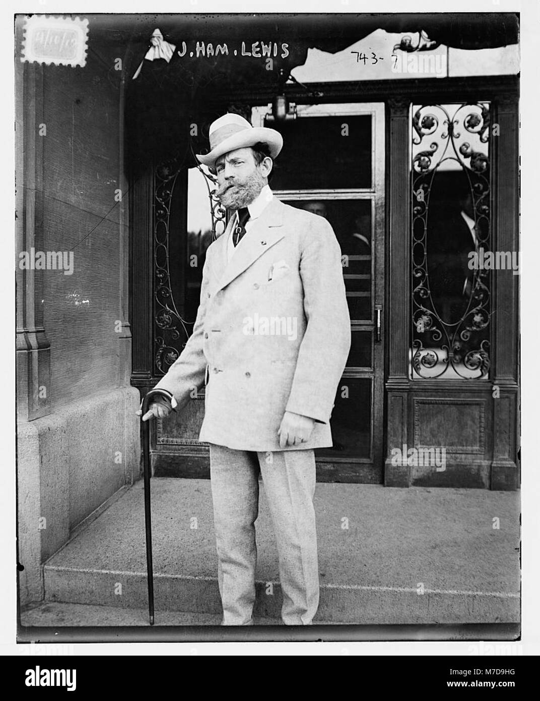 Portrait of J. Ham Lewis holding a cane, a prominent individual from ...