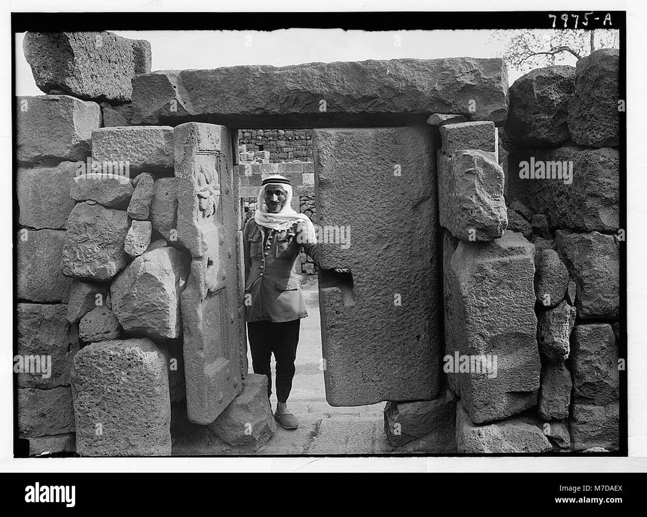 A photograph showcasing the double stone (basalt) doors at Kanawat in ...