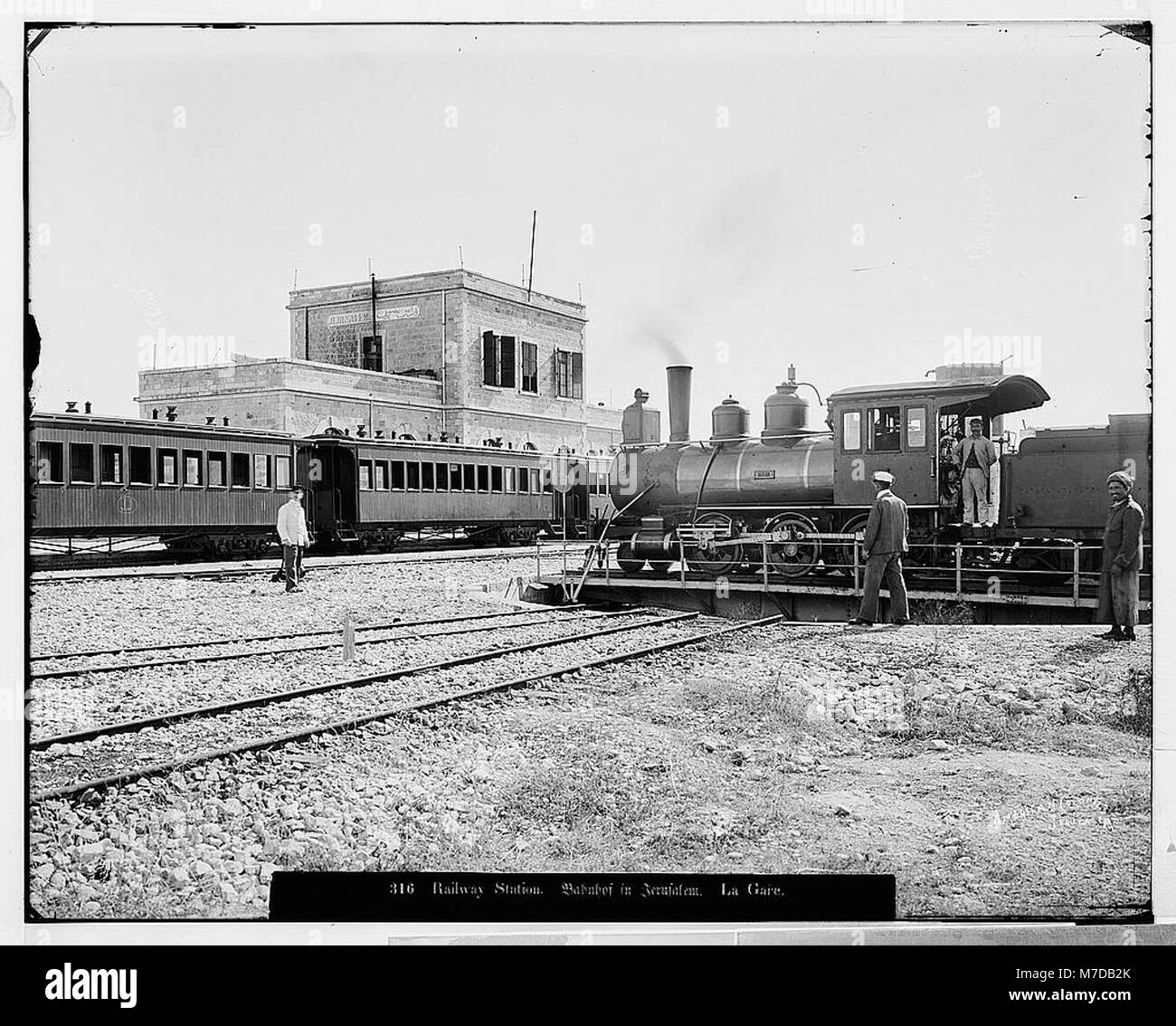 The photograph shows the railway station in Jerusalem (El-Kouds), an ...