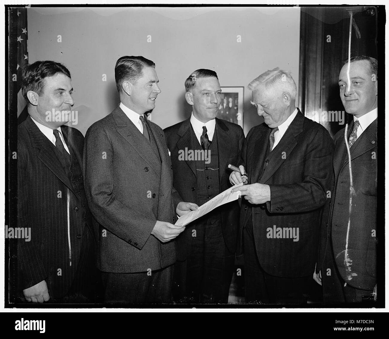 This image shows John N. Garner, second from the right, alongside ...