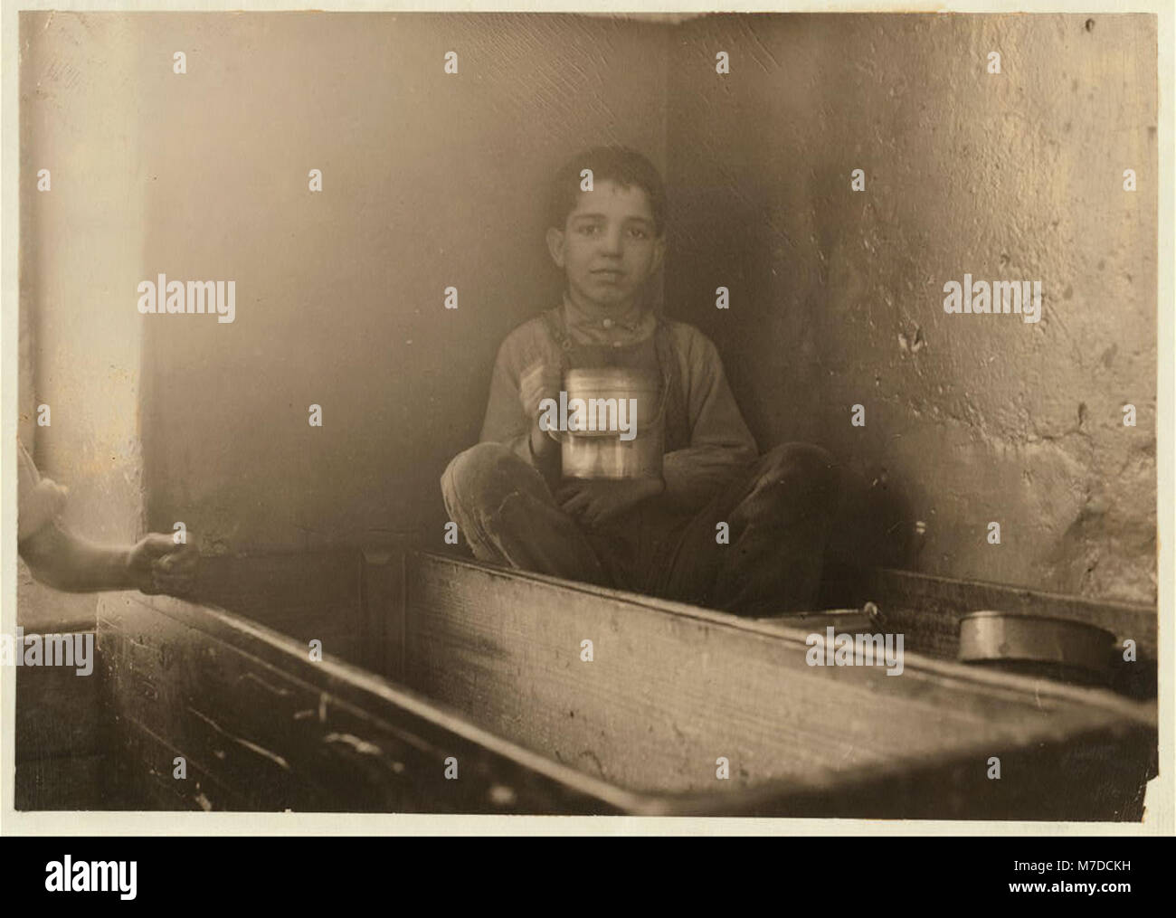 This photograph depicts Jo Benevidos resting in a doffing box at 5 ...