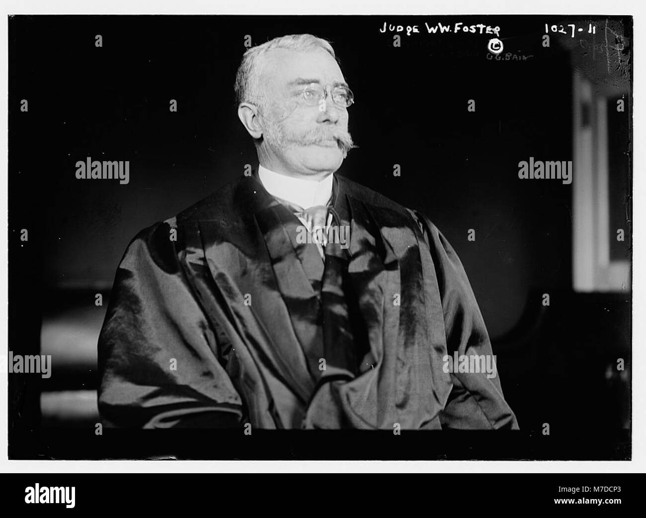 Judge W.W. Foster is depicted in his judicial robe, symbolizing his ...