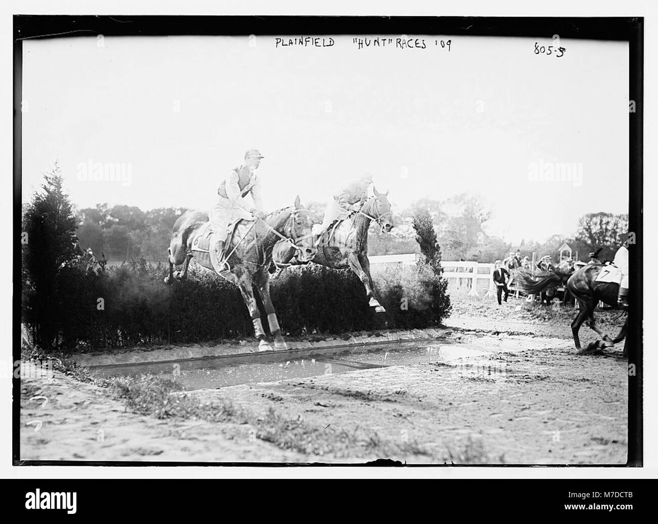 This image shows participants jumping hedges during a Hunt Race in ...