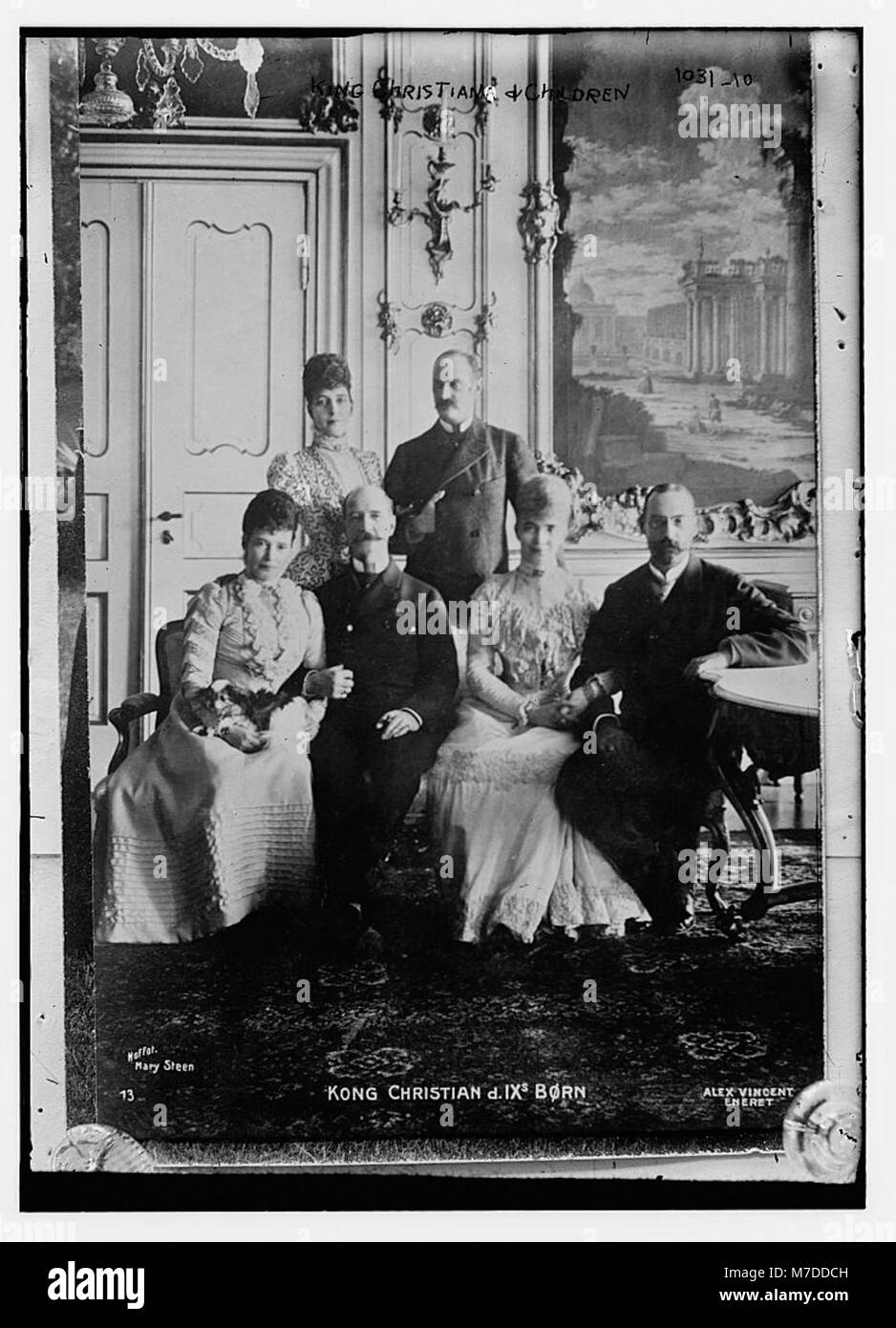 This photograph depicts King Christian, a monarch, with his children in ...