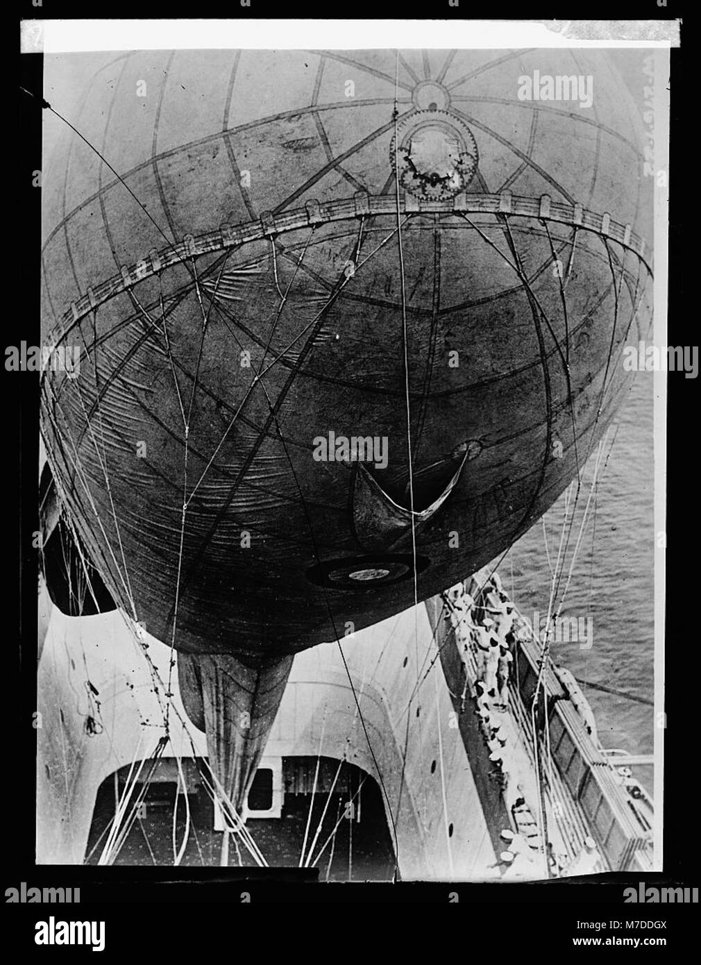 A kite balloon is seen in the 'Well' of the U.S.S. Wright, illustrating ...