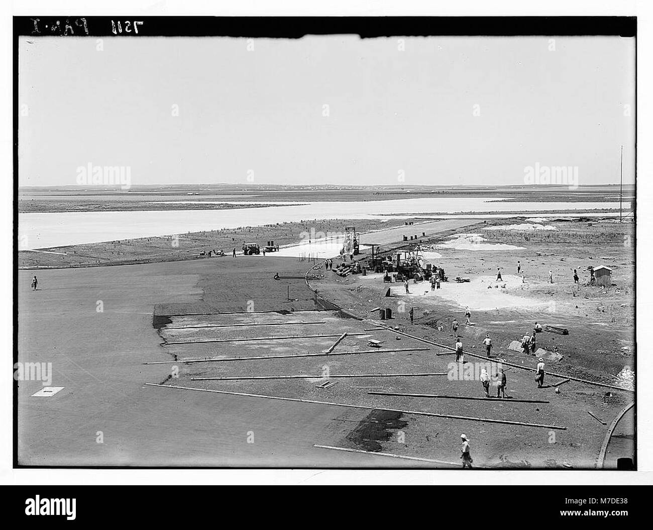 A photograph showing the landing ground at Lydda Airport in two ...