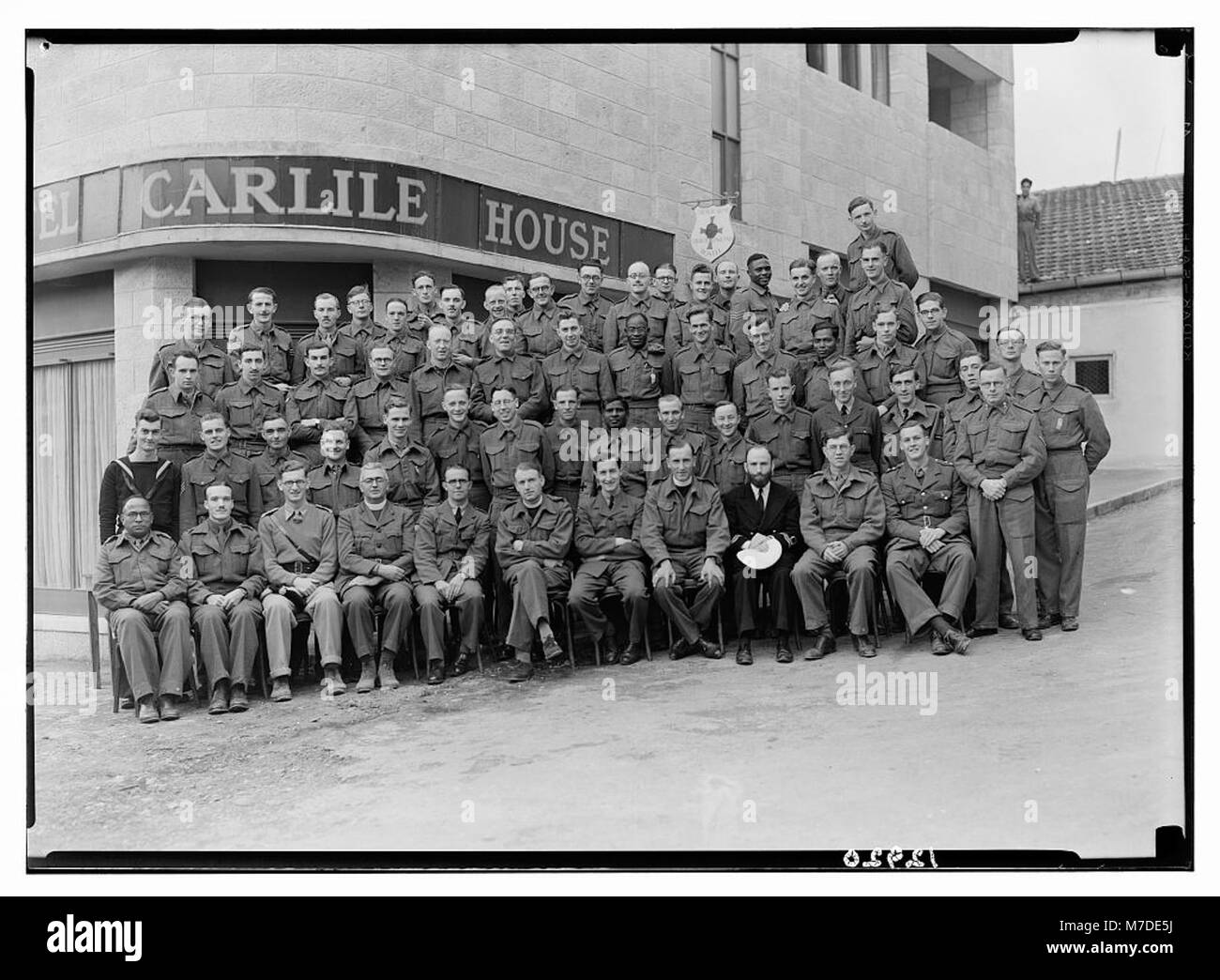 A group of soldiers stands in front of the Carlisle House in Jerusalem ...