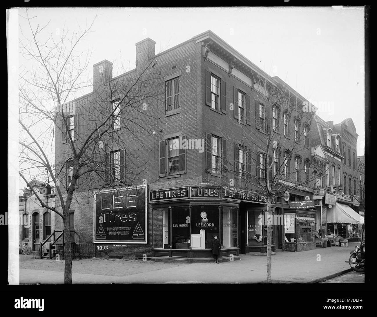 An exterior photograph of the Lee Tire Sales Company, showcasing the ...