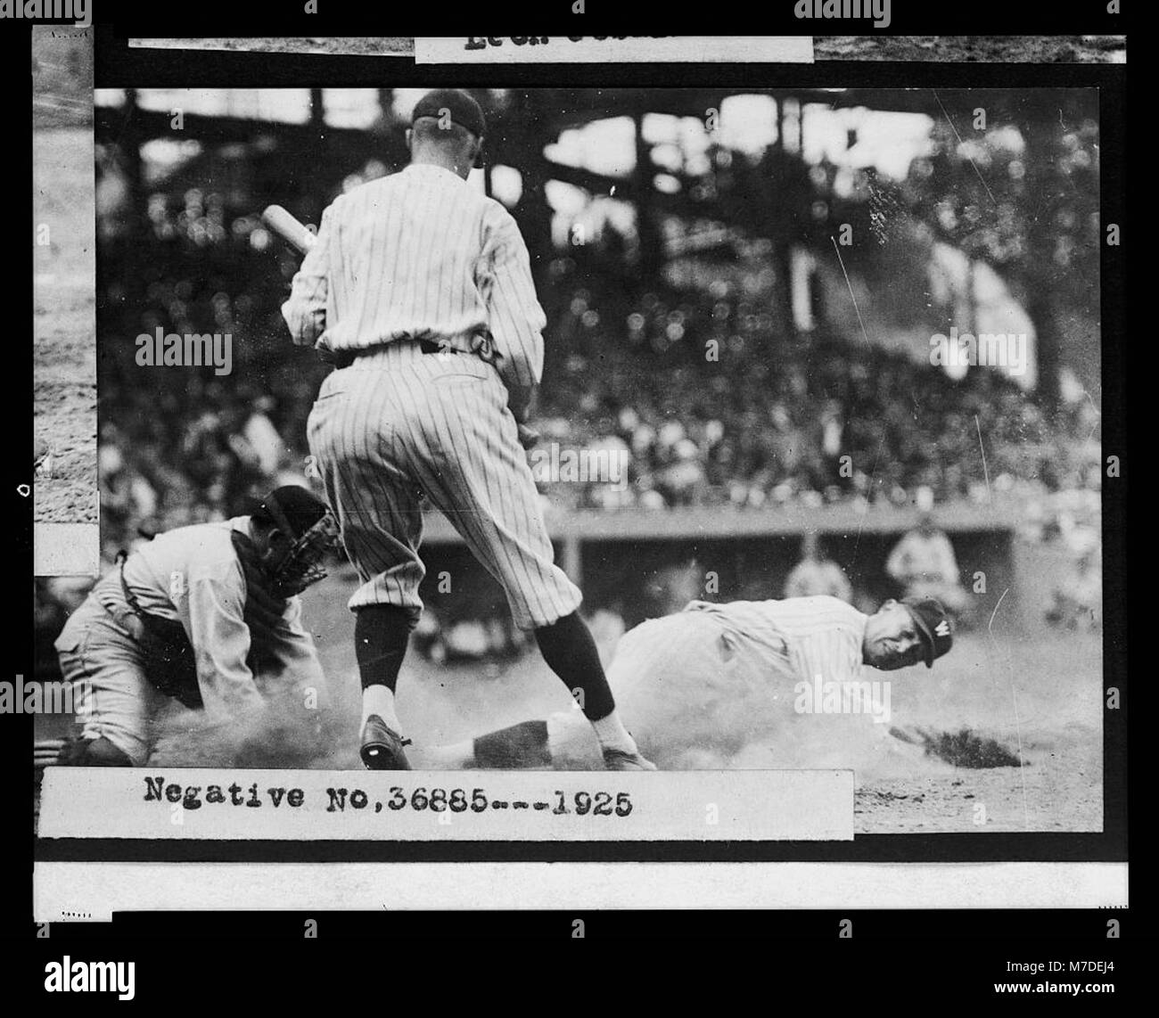 Leon A. 'Goose' Goslin of the Washington Nationals slides into home ...