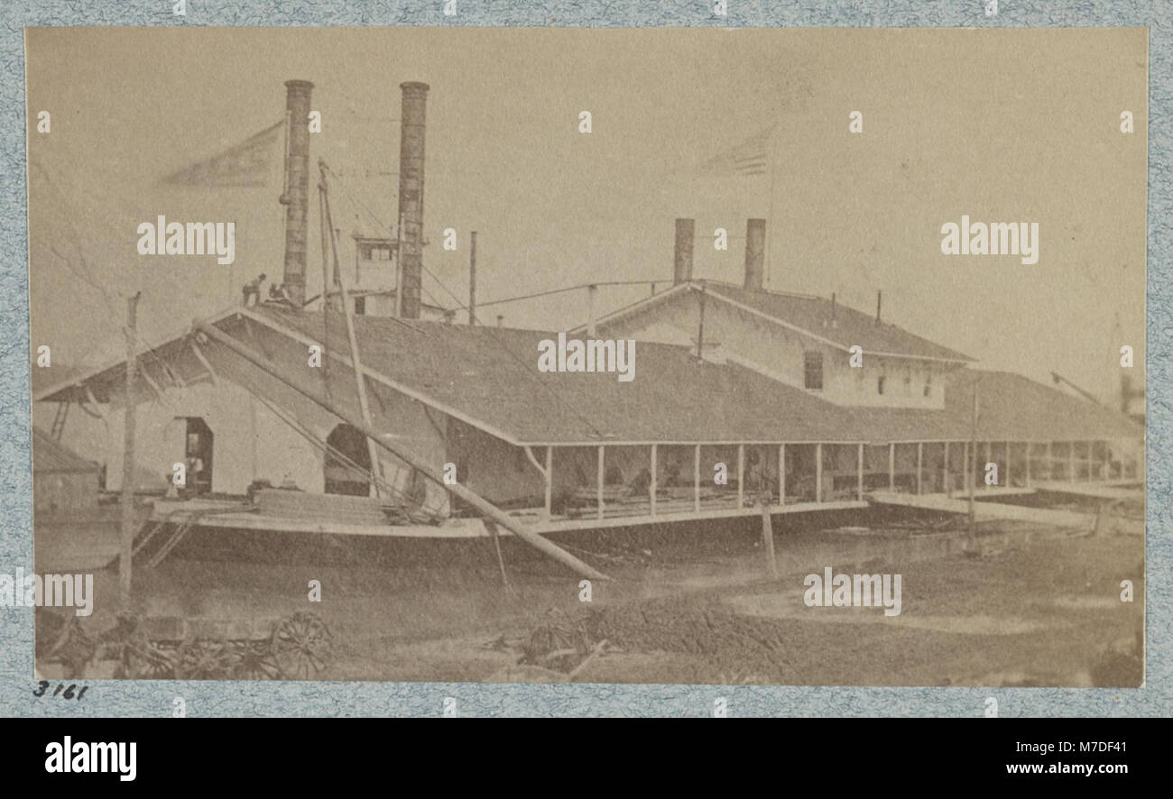 A historic photograph of a wharf boat at Cairo, Illinois, in 1864. This ...