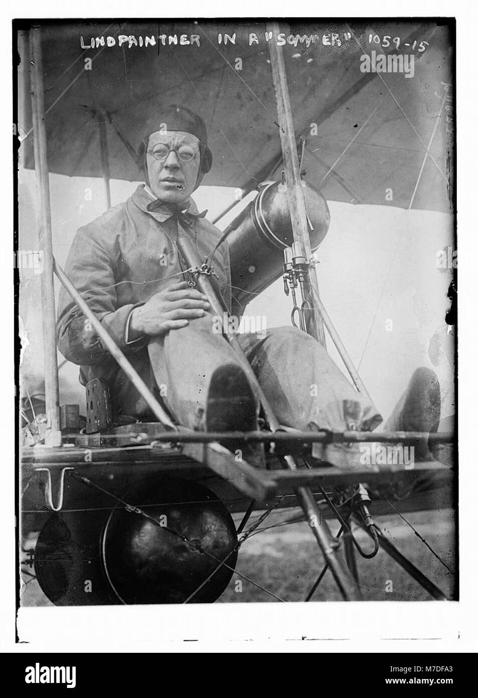Lind Painter is shown inside a 'Sommer' aeroplane, showcasing the early ...