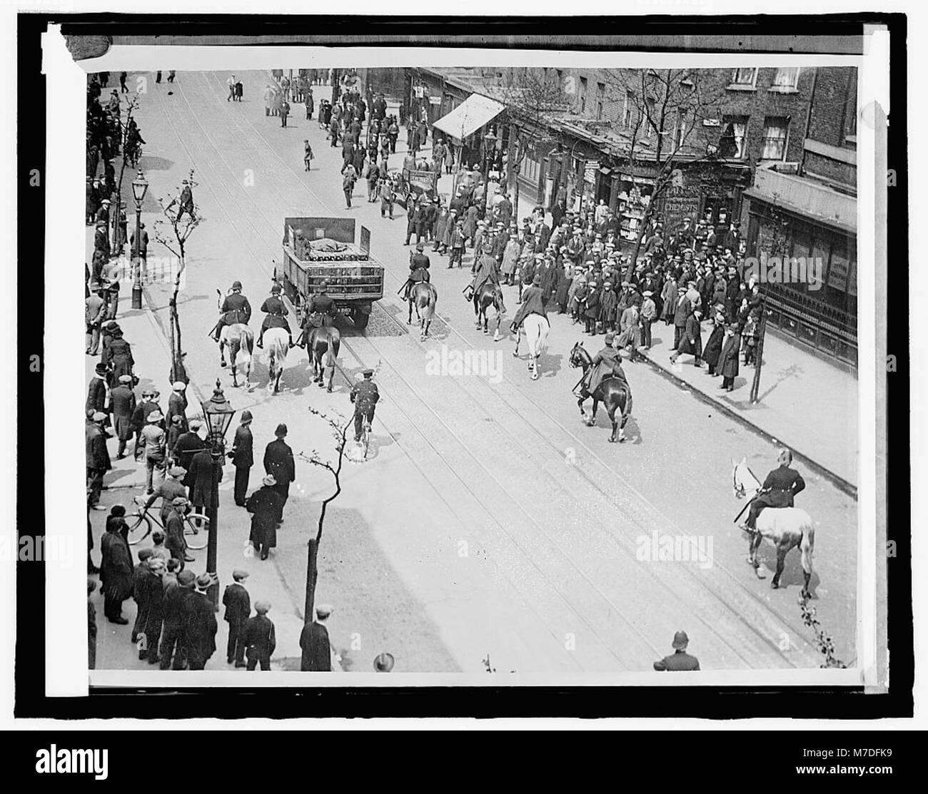 This image captures a labor strike in London, depicting workers' rights ...